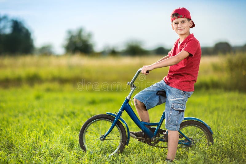 Young Boy Riding Bicycle in a Park Stock Image - Image of child ...