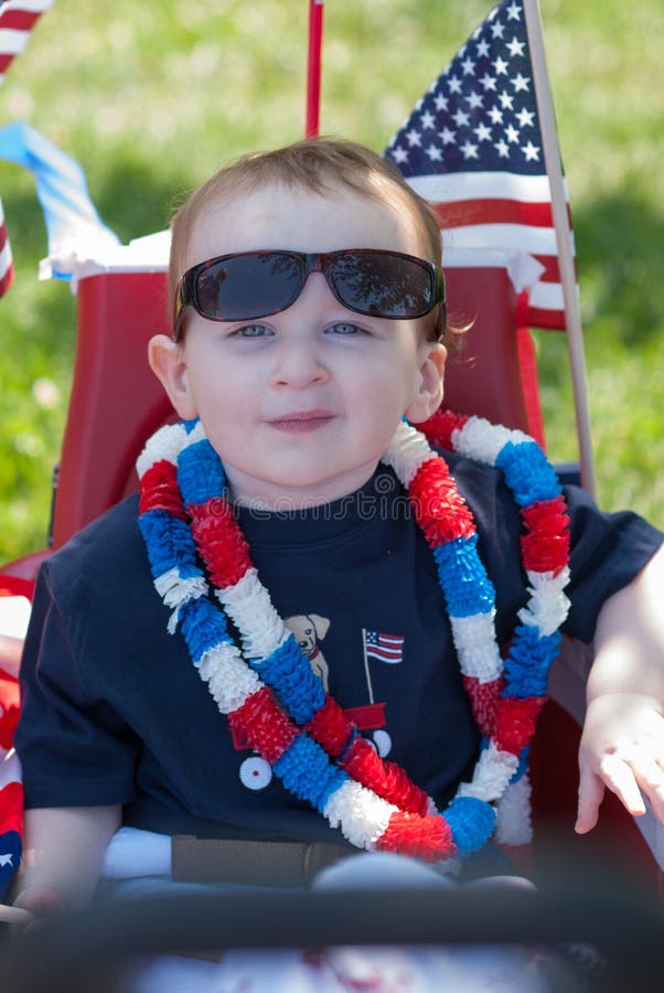Young Boy Riding in Red Wagon Having Fun in the Park for July Fourth ...