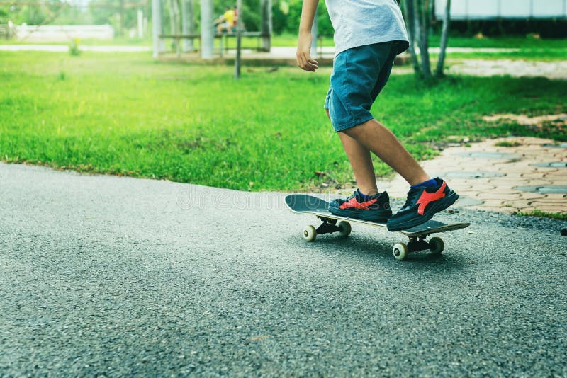 Young Boy Riding a Skateboard at a Skating Rink Stock Photo - Image of ...