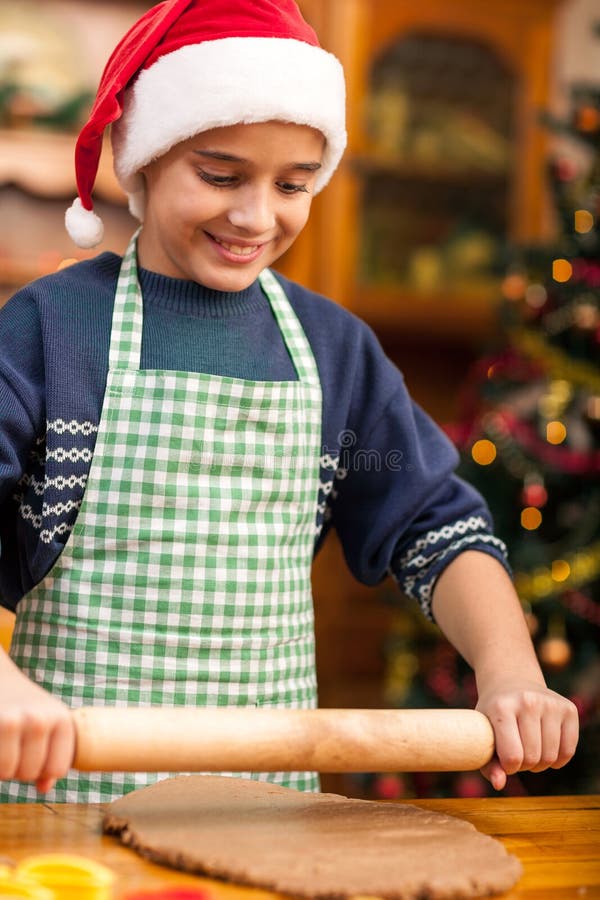 Young Boy with Rolling Pin Preparing Christmas Cookies Stock Photo ...