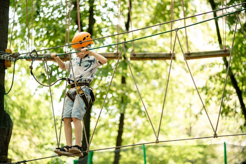Young Boy in the Rope Park. Active Rest of the Child in the Park Stock ...