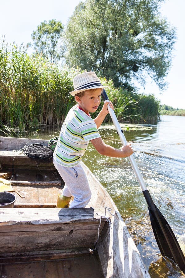 Young man rowing a boat stock photo. Image of sport - 118054638