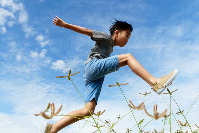 Young boy run and jump stock image. Image of smile, success - 143469137