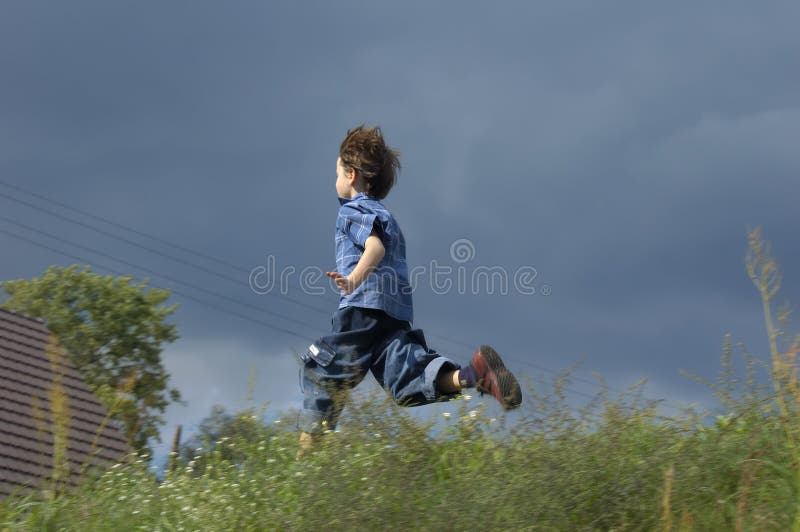 Young Boy Jumping and Shouting Stock Image - Image of weather, outdoors ...