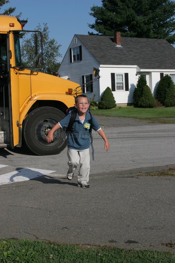 Young Boy Running Off the School Bus Smiling Stock Image - Image of ...