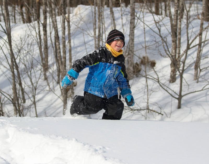 Child running in snow stock photo. Image of active, running - 139670322