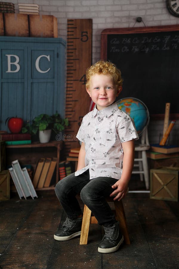 Young Boy Sat on Stool in School Stock Image - Image of cute, casual ...