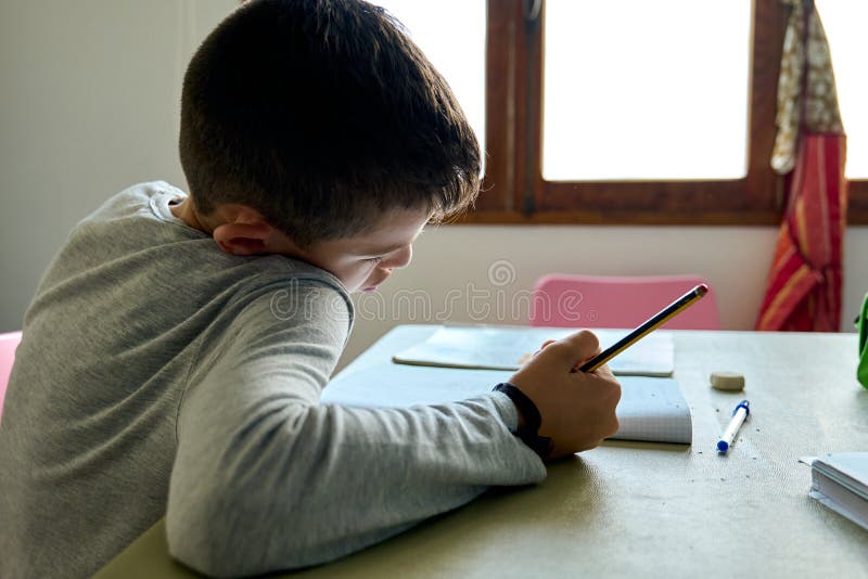 8 Year Old Boy Doing His Homework Stock Photo - Image of child, single ...