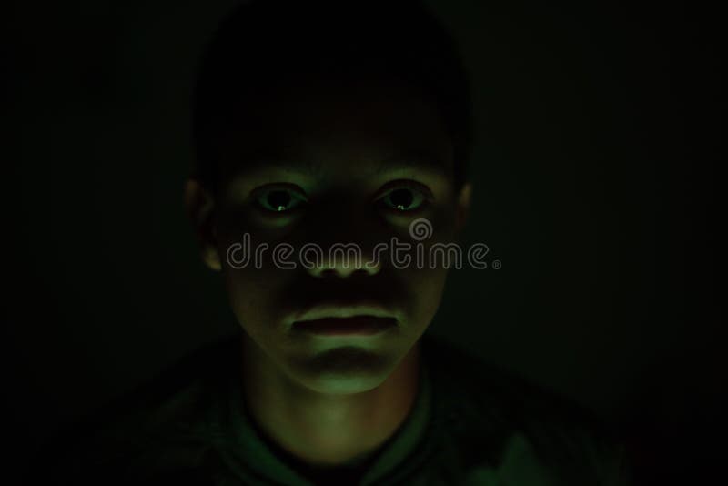 Close Up Portrait of Young Boy in Dark Room Stock Photo - Image of ...