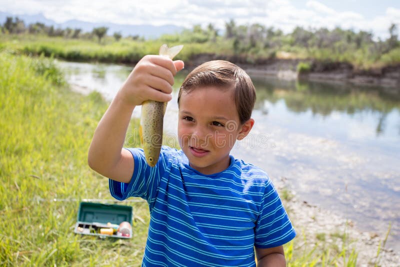Young Boy Showing the Fish he Caught. Stock Photo - Image of emotion ...