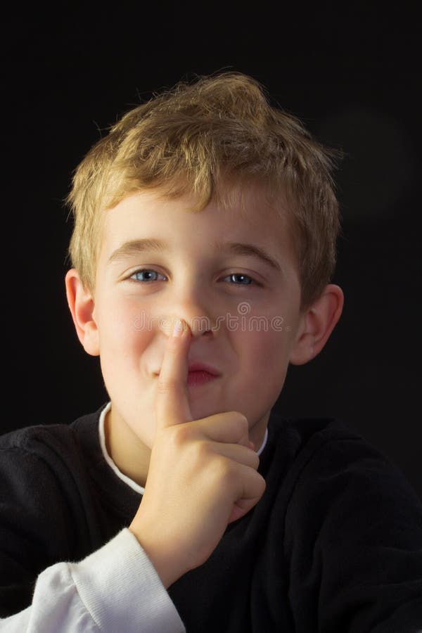 A Young Boy Signals for Quiet Stock Photo - Image of manipulative ...