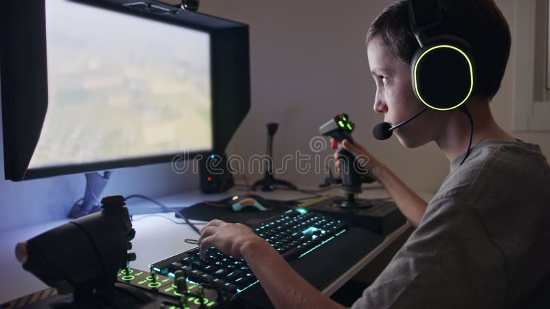 Young Boy Playing a Flight Simulator Wearing a Headset Stock Video ...