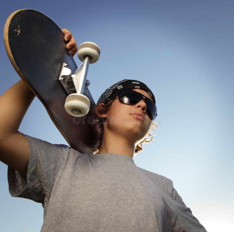 Young Boy with Skateboard in Hand Stock Photo - Image of shirt, male ...