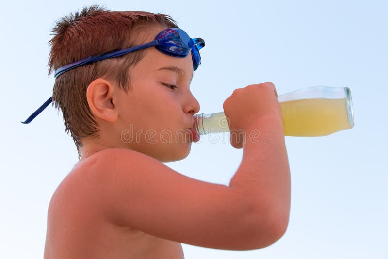 Young Boy Slaking His Thirst Stock Photo - Image of juice, cutie: 27005278