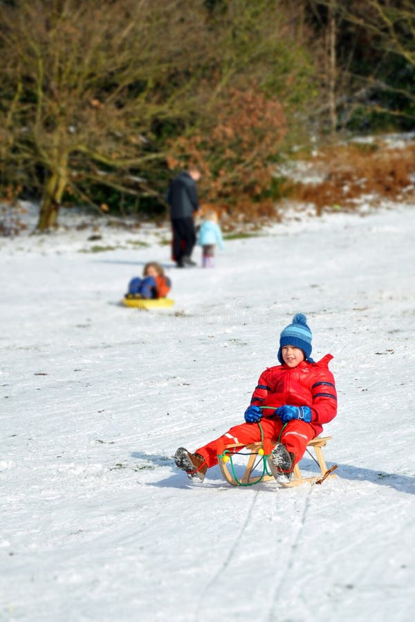 Young Boy in Sledge Sliding Snowy Hill, Winter Fun Stock Image - Image ...
