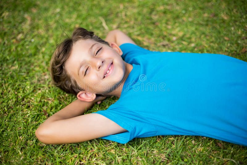 Young boy sleeping in park stock image. Image of closed - 77904613