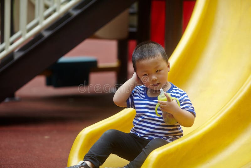 Young boy on slide stock image. Image of toddler, play - 72126515