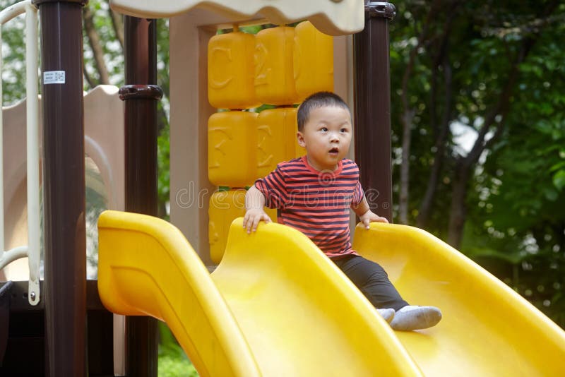 Young boy on slide stock image. Image of colorful, happy - 72126893
