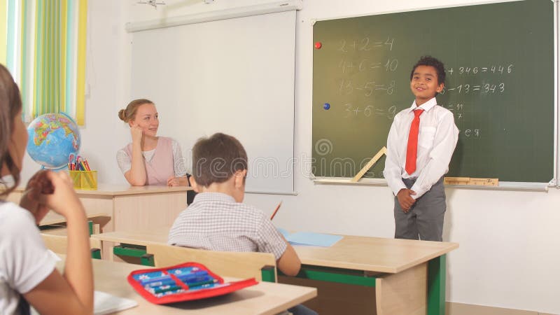 Female Teacher Teaching Group of Teenagers in High School Lesson Stock ...