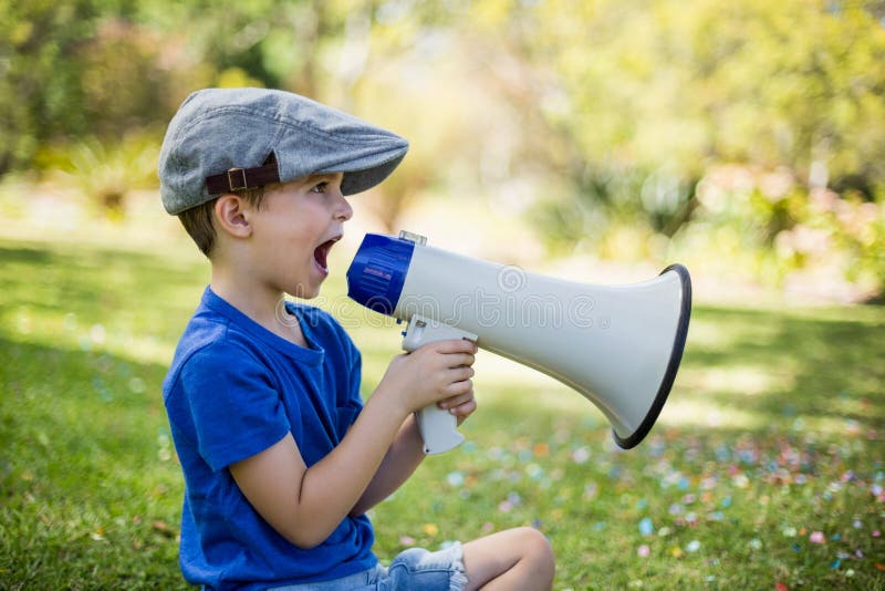 Young Boy Speaking on Megaphone Stock Image - Image of parkland ...