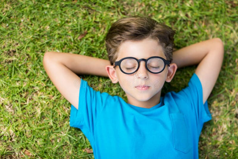 Young Boy in Spectacle Sleeping in Park Stock Photo - Image of eyes ...