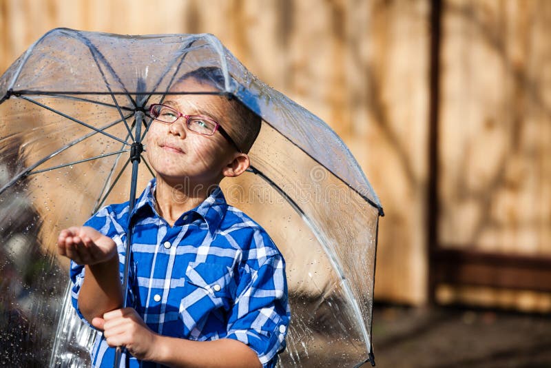 Young Boy in a Sun Shower with Umbrella Stock Image - Image of healthy ...
