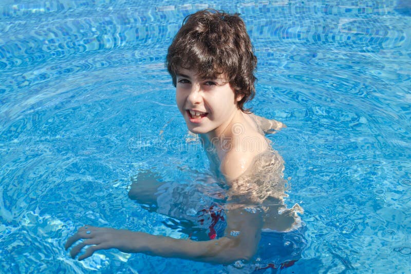 Young Boy is in the Swimming Pool Stock Photo - Image of casual ...