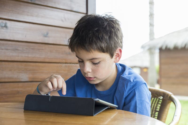 Young Boy and a Tablet Digital Stock Photo - Image of caucasian ...
