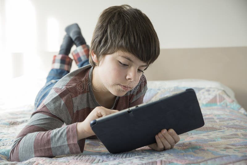 Young Boy and a Tablet Digital Stock Photo - Image of years, room: 40501786