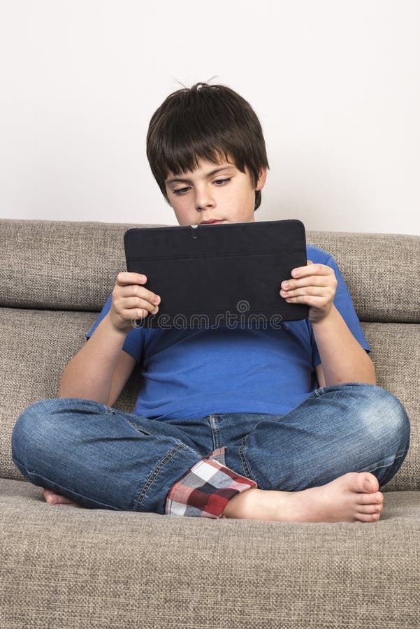 Young Boy and a Tablet Digital Stock Image - Image of room, computer ...