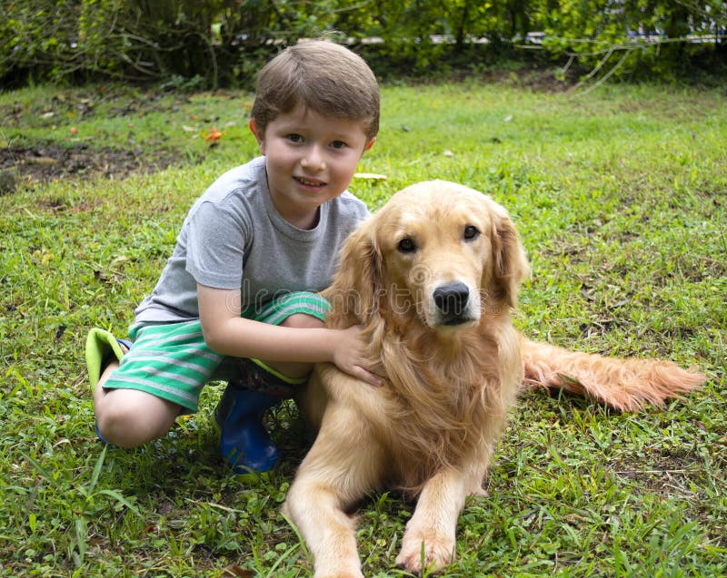 Young boy taking dog stock image. Image of child, love - 258292789