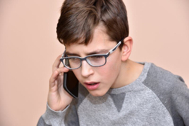 Young Boy Talking on His Smart Phone Stock Image - Image of holding ...