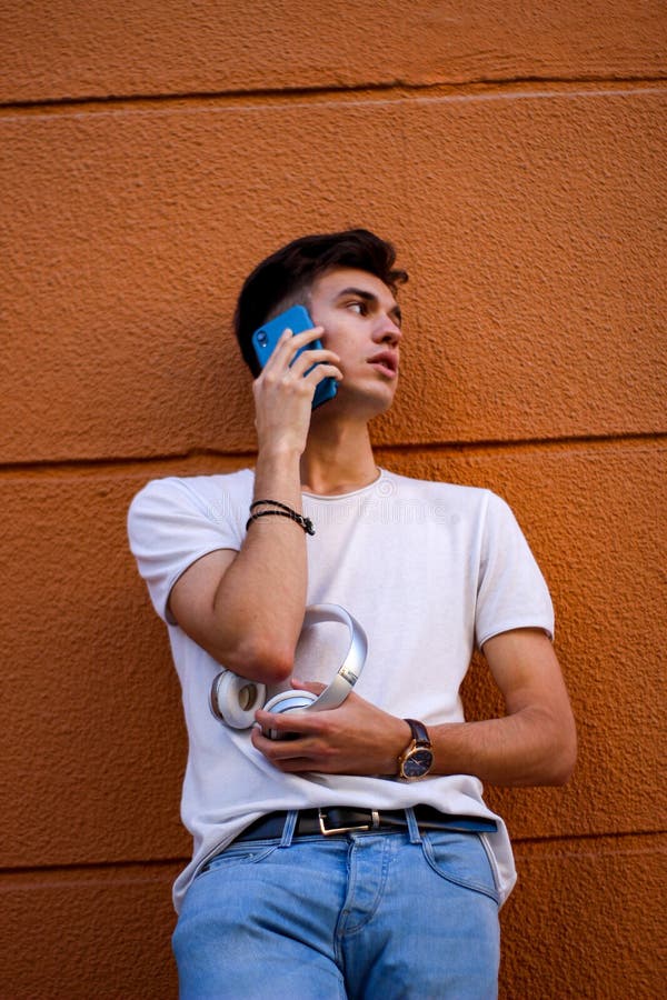 Young Boy Talking on the Phone in the Street Stock Photo - Image of ...