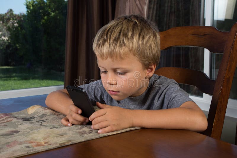 Young Boy Texting on Phone stock image. Image of message - 34096095
