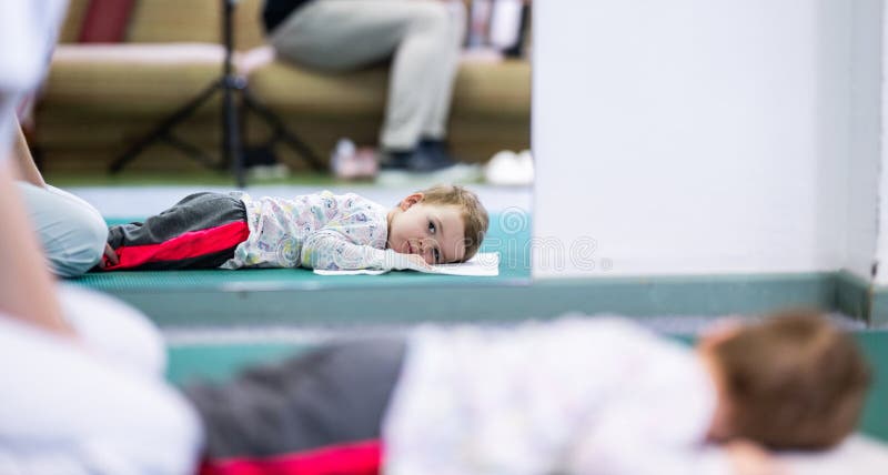 Child on Therapy Mat during SessionYoung Boy on a Therapy Mat during a ...