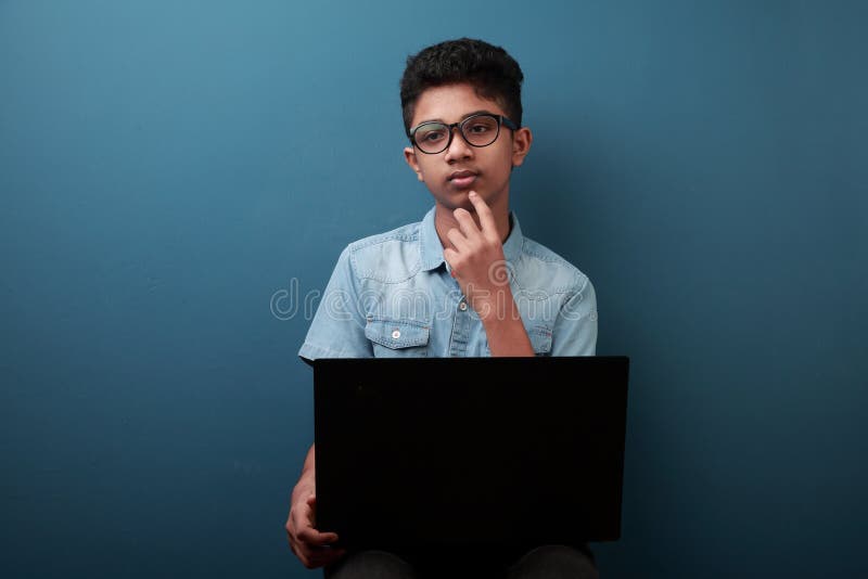 Thinking Young Boy with Laptop Stock Image - Image of room, computer ...