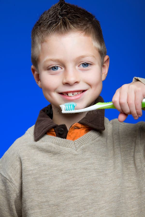 Studio Shot of a Boy Brushing Teeth Stock Image - Image of people ...