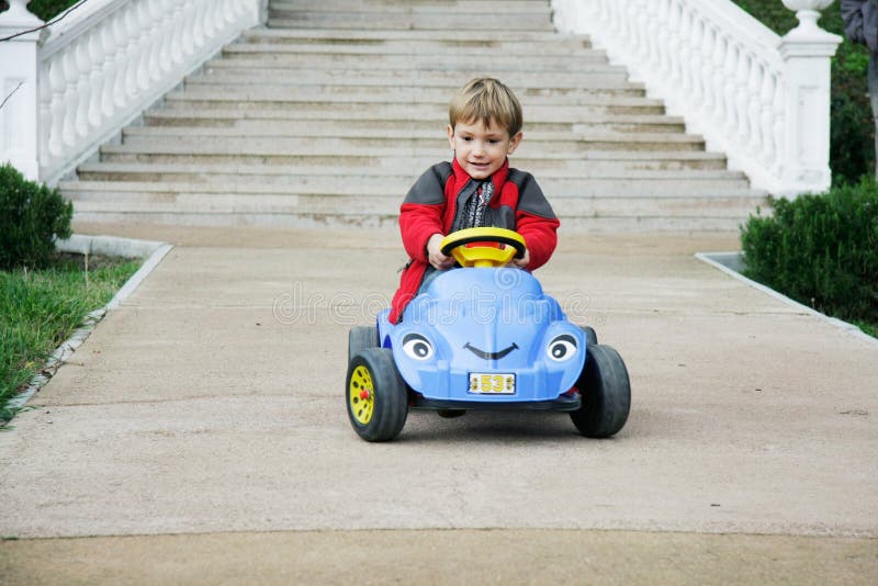 Young boy in toy car stock image. Image of transport - 17517971