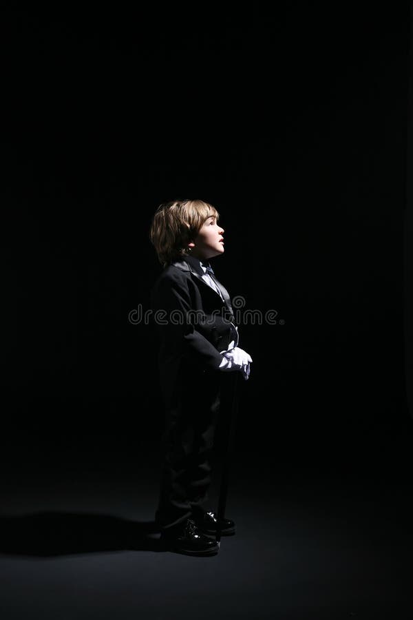 Young Boy in Tuxedo Looking Off To the Side Stock Photo - Image of cute ...