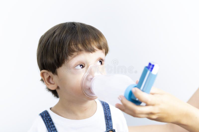 Young Boy Using Inhaler stock photo. Image of child - 148997382