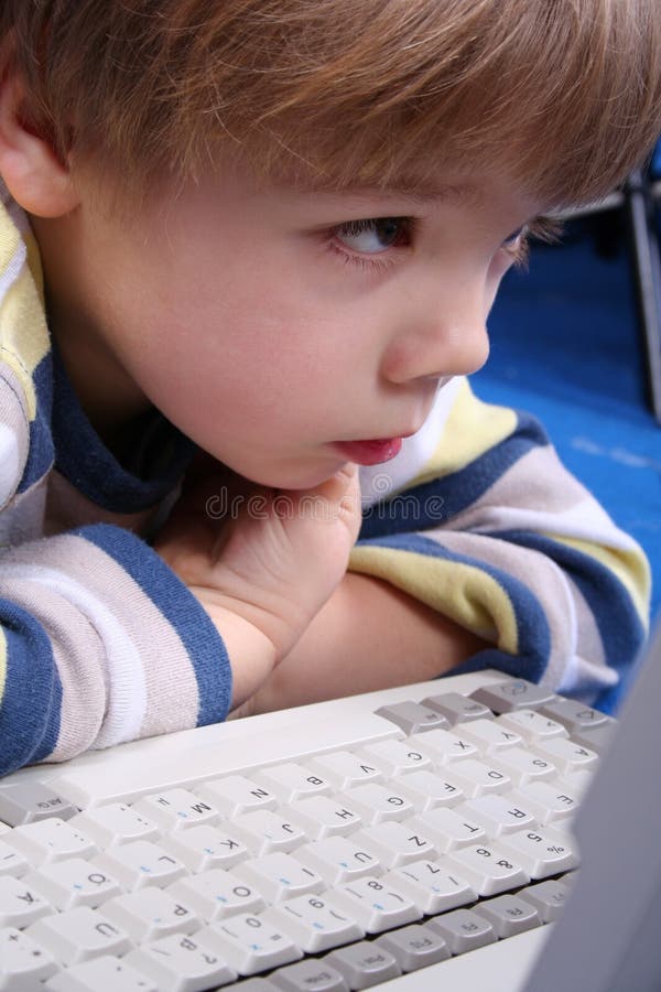 Young boy using a laptop stock photo. Image of face, computer - 7688462