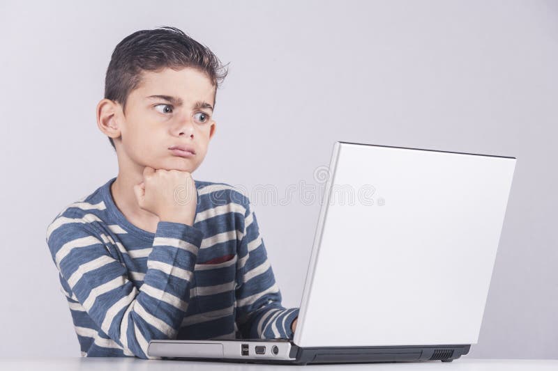 Young Boy Using a Laptop Computer Stock Photo - Image of study ...