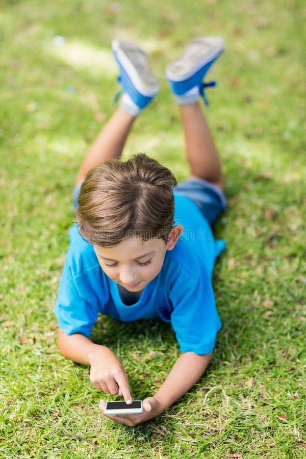 Young Boy Using Mobile Phone Stock Image - Image of countryside, male ...