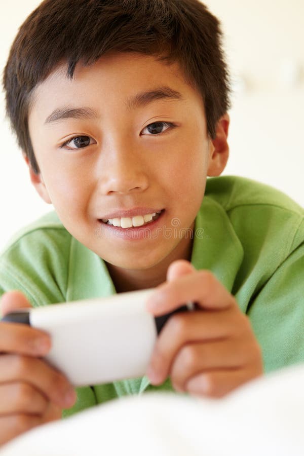 Young boy using smartphone stock photo. Image of browsing - 55892458