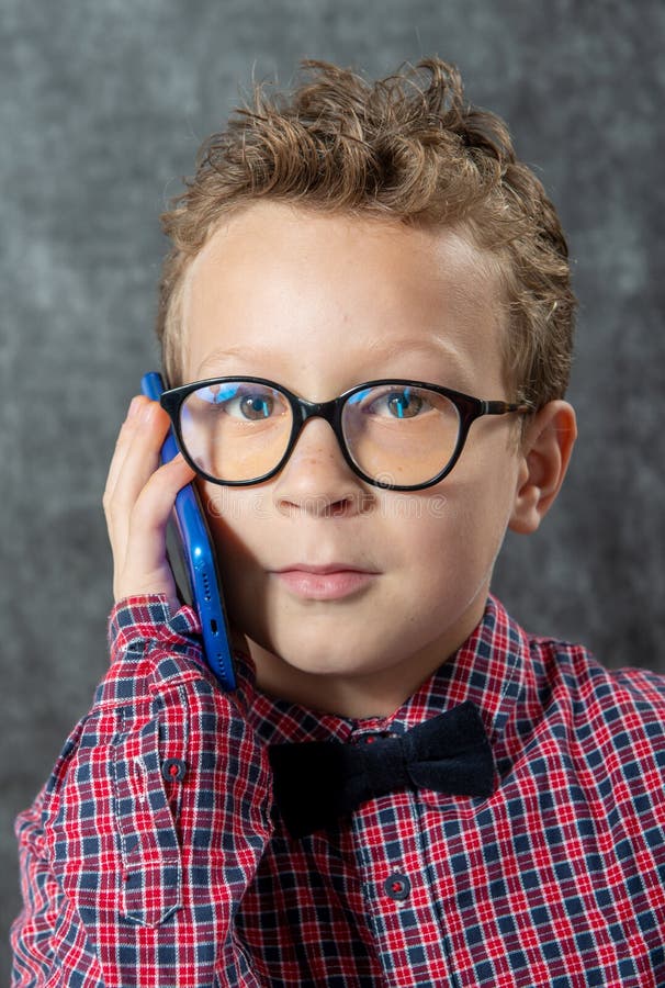 Young Boy Using a Smartphone for Talking Stock Photo - Image of ...