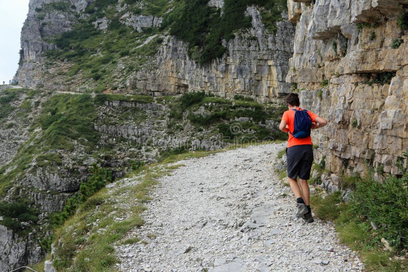 Young Boy Walks a Difficult Path on the Alps Stock Photo - Image of ...