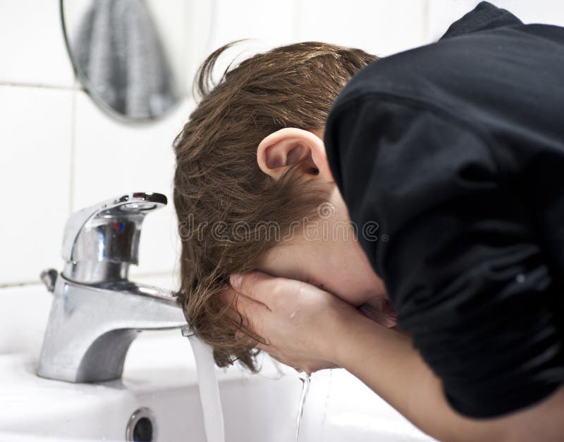 Young boy washing his face stock photo. Image of routine - 28062508