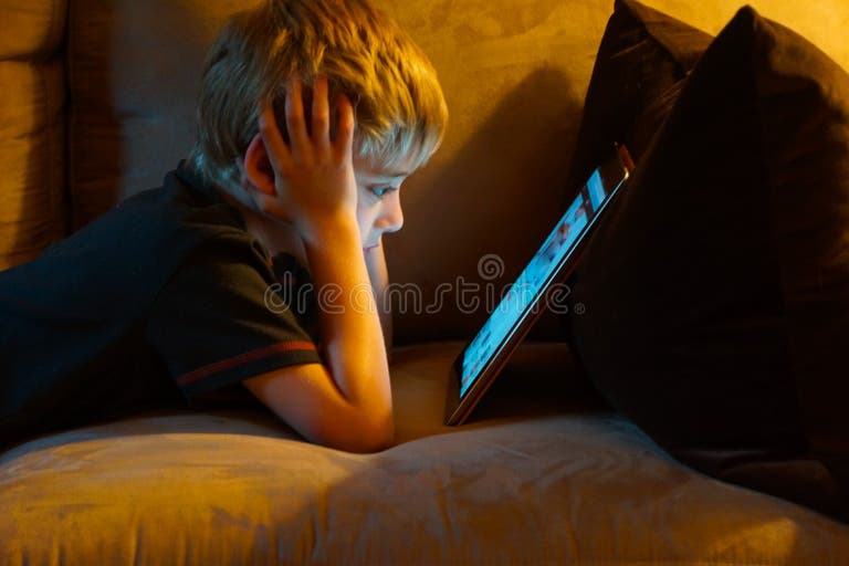 Young Boy Watching iPad stock photo. Image of school - 92838626