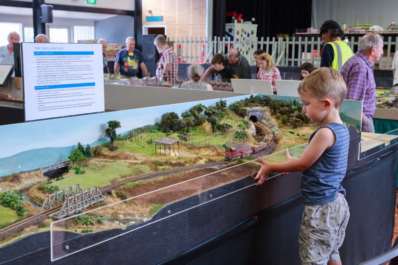 A Young Boy Watching a Train at a Model Railway Show Editorial Stock ...