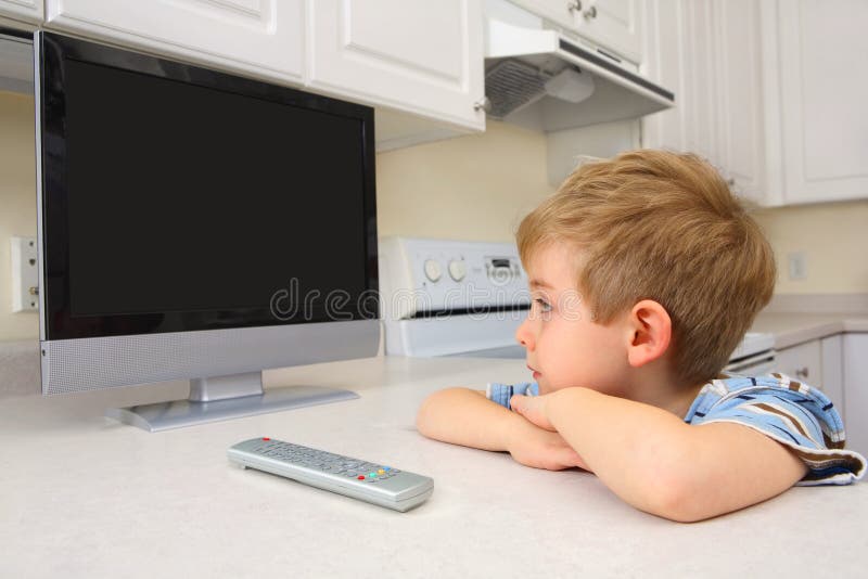 Young Boy Watching Tv in a Kitchen Stock Photo - Image of show ...